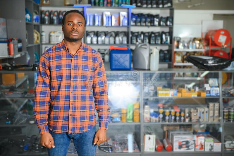 Smiling African Salesman Auto Parts Store Stock Image - Image of shop ...