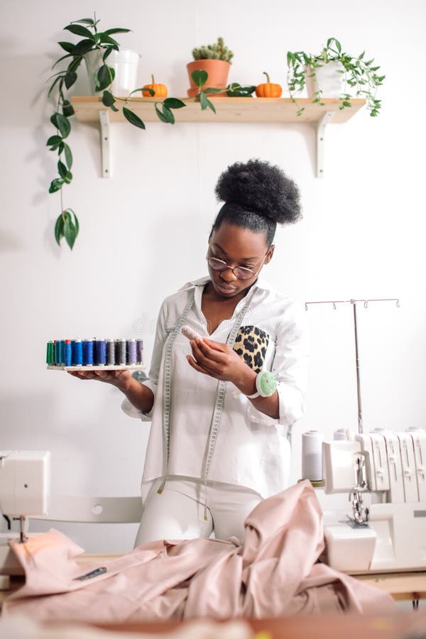 African Seamstress Holding Coils with Threads Stock Image - Image of ...
