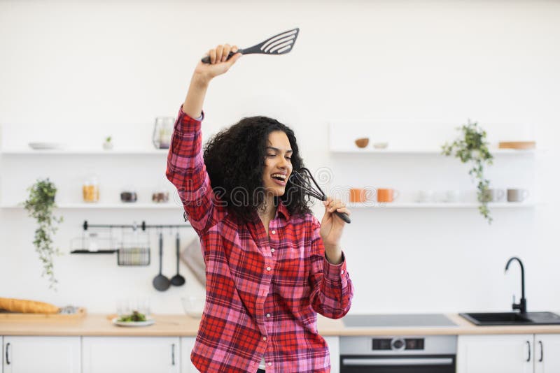Young African Woman Singing Kitchen Utensils Modern Home Stock Photos ...