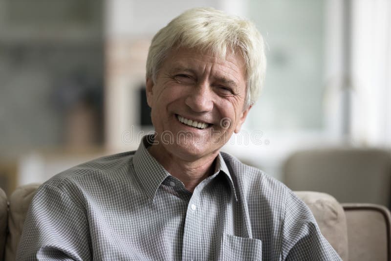 Smiling Aged Man Sit on Sofa Staring at Camera Stock Image - Image of ...