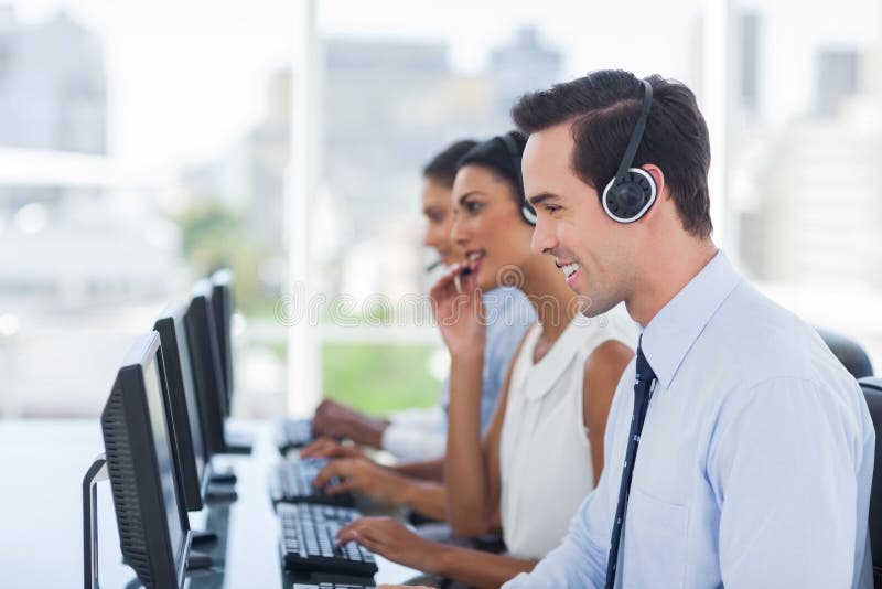 Smiling Agent Working in a Call Centre Stock Photo - Image of ...