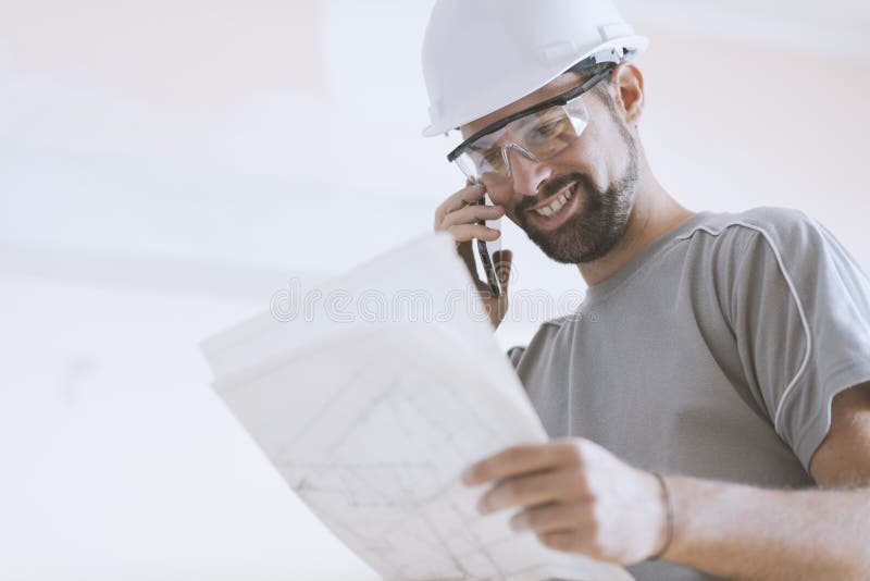 Smiling Architect Having a Phone Call Stock Photo - Image of contractor ...