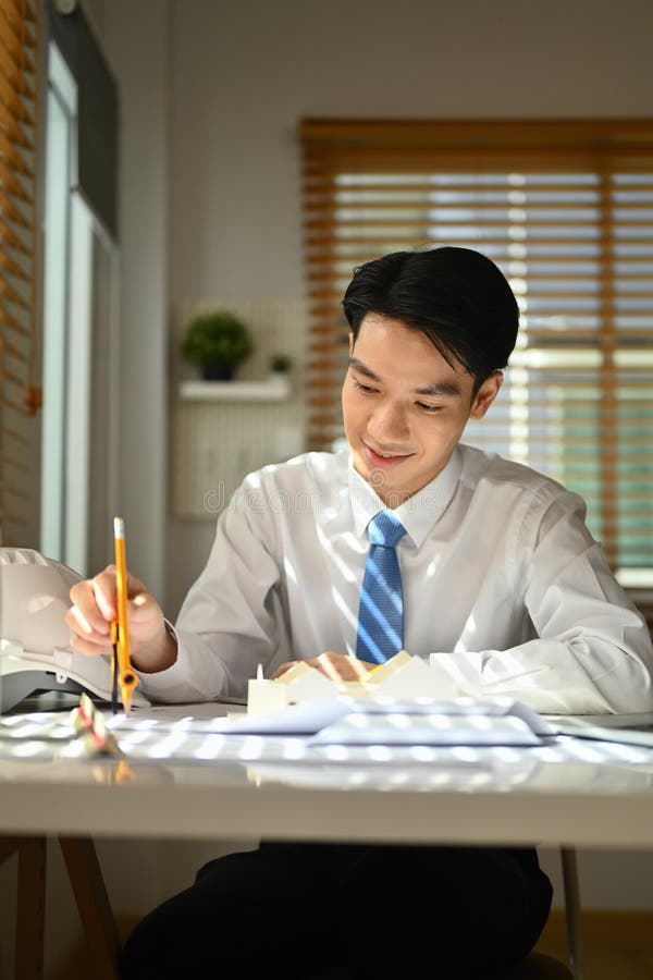 Smiling Architect Man Hand Compass To Measuring Scale On A Blueprint Building Construction And