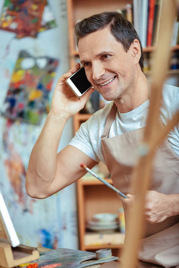 Smiling Artist Talking on Cellphone in Painting Studio Stock Image ...