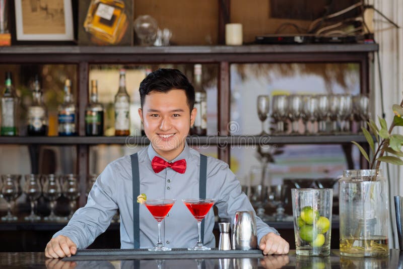 Smiling Asian bartender stock image. Image of drink, portrait - 53464043