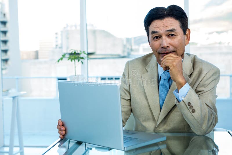 Smiling Asian Businessman Working on Laptop Stock Image - Image of ...