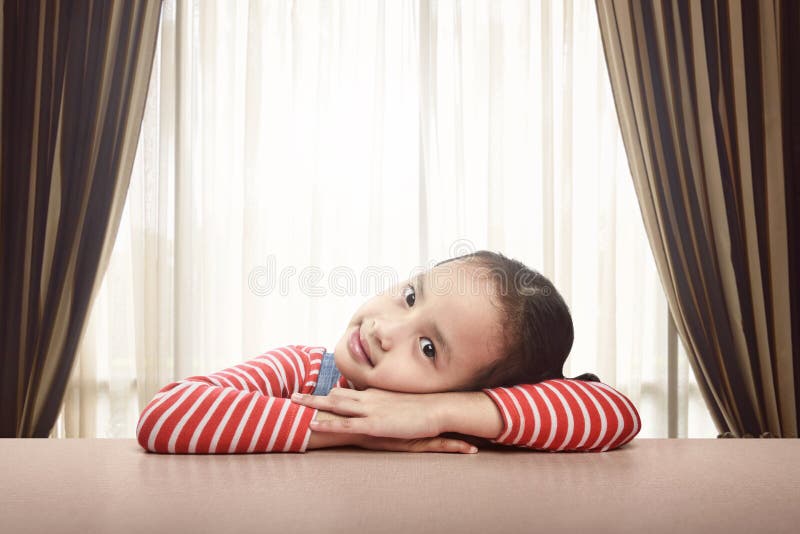 Smiling Asian Kid Rests on the Table Stock Photo - Image of enjoy ...