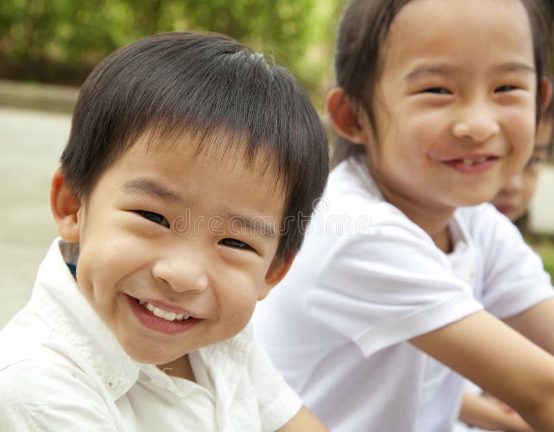 Smiling asian kids stock image. Image of family, embracing - 19437273