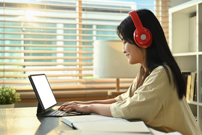 Smiling Asian Student Girl Wearing Headphone Watching Online Tutorial ...