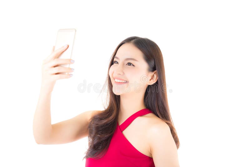 Smiling Asian Young Woman Takes A Selfie On Smartphone Stock Image