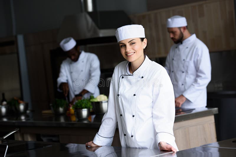 Smiling Attractive Chef Looking at Camera Stock Photo - Image of ...
