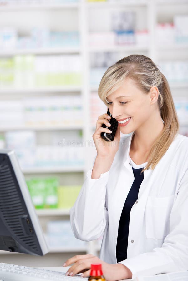 Smiling Attractive Pharmacist Talking at the Phone Stock Photo - Image ...