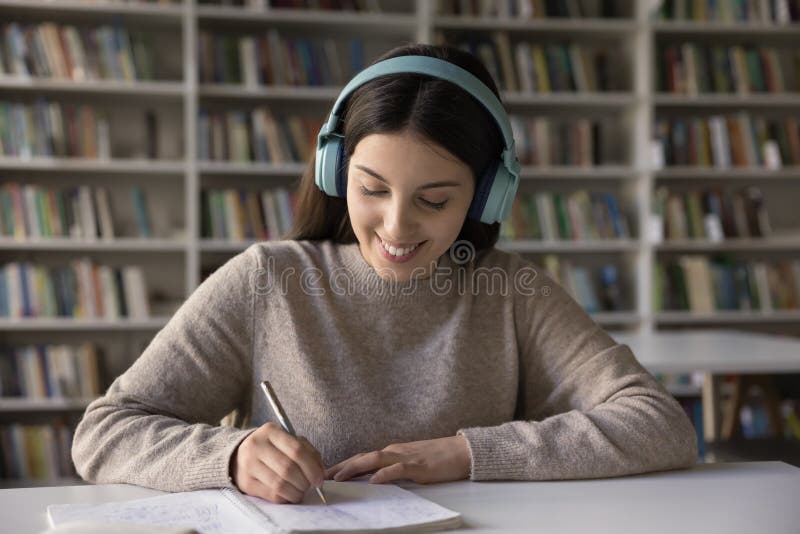 Girl Listens Audio Task, Improve Language Knowledge Studying in Library ...