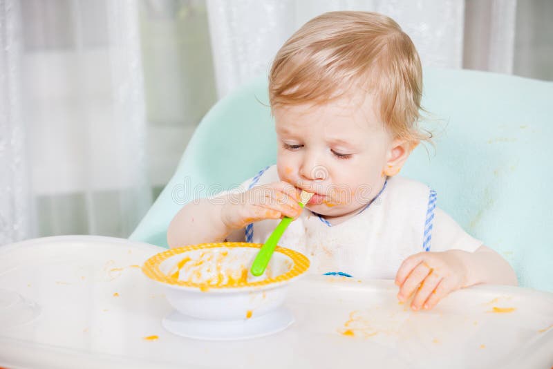 Smiling Baby Eating Food on Kitchen Stock Photo - Image of close, funny ...