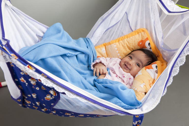 Smiling Baby in a Hammock-Style Cradle Stock Photo - Image of ...