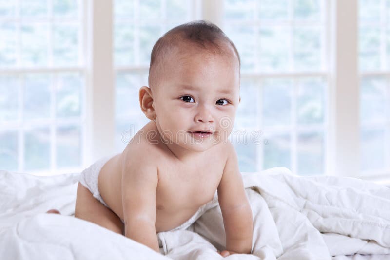 Smiling Baby Looking at Camera Stock Photo - Image of adorable, blanket ...