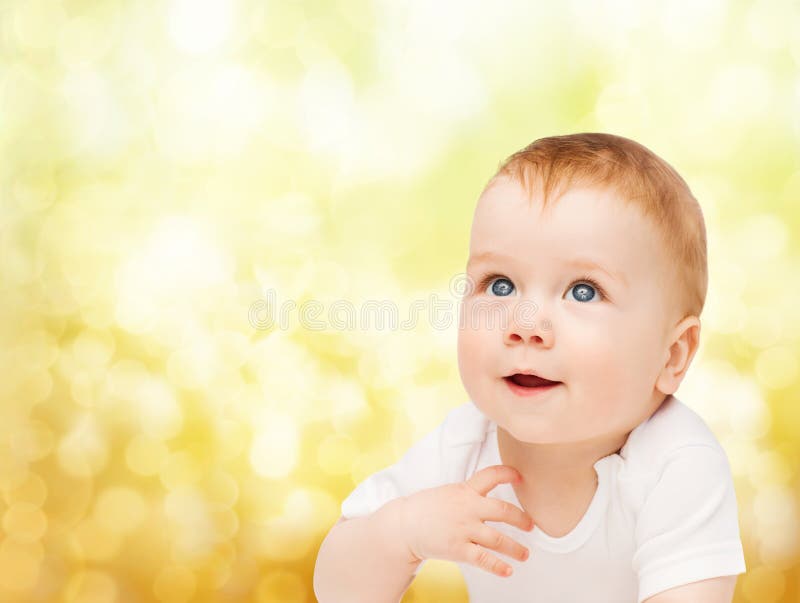 Smiling baby looking up stock photo. Image of infant - 42709314