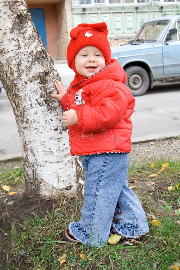 Smiling baby near tree stock photo. Image of asphalt, brown - 3638642