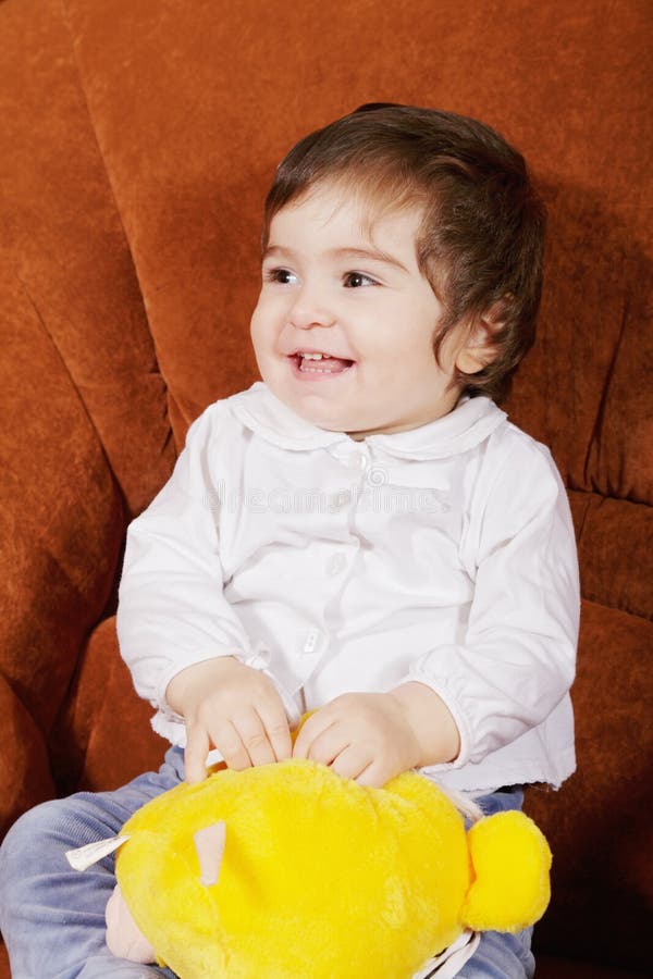 Smiling baby with soft toy stock photo. Image of smiling - 19478404