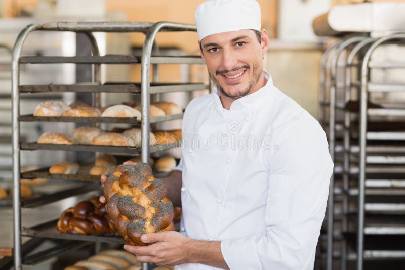 Smiling Baker Holding Fresh Loaf Stock Image - Image of rack ...