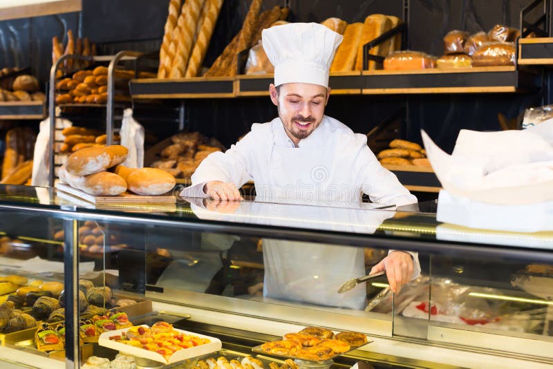 Smiling Baker Showing Assortment of Bakery Stock Photo - Image of tarts ...