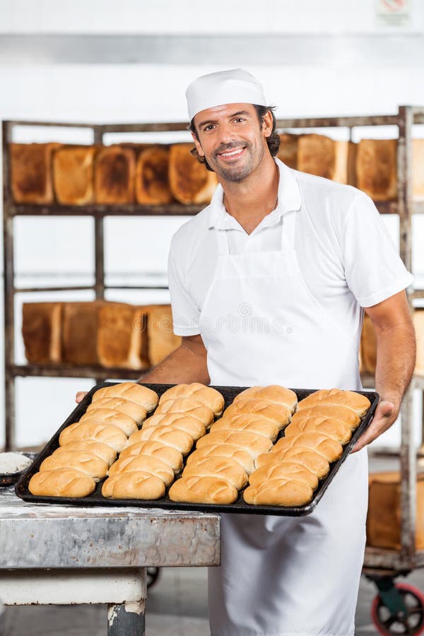Smiling Baker Showing Breads in Baking Tray Stock Image - Image of ...