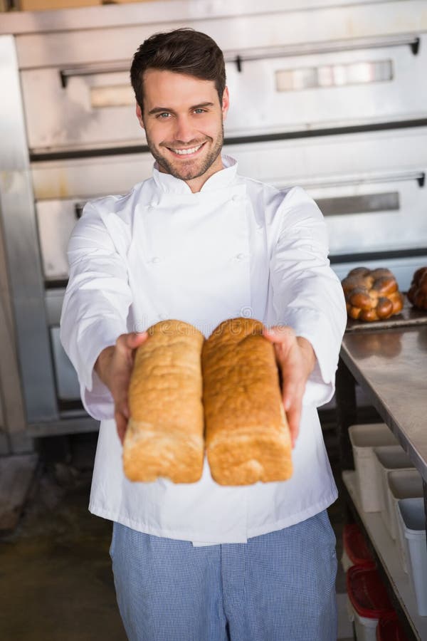 Smiling Baker Showing Loaves of Bread Stock Photo - Image of person ...