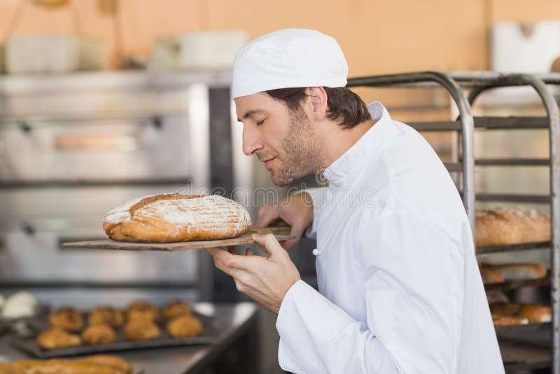 Smiling Baker Smelling Fresh Bread Stock Image - Image of building ...