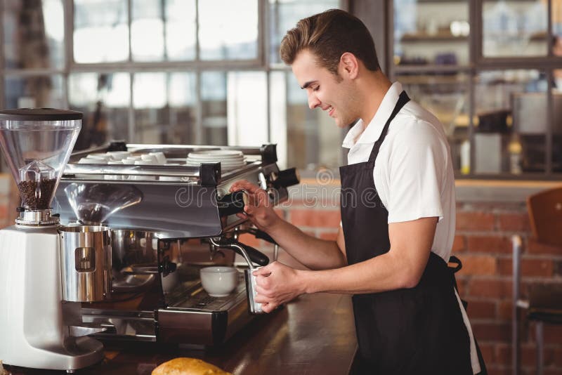 Smiling Barista Steaming Milk at Coffee Machine Stock Image - Image of ...