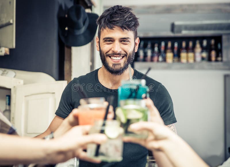 Smiling Bartender with Cocktails Toast Stock Photo - Image of glass ...