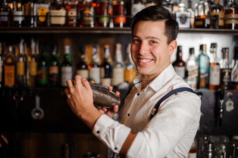 Smiling Bartender Putting a Big Ice Cube Using Special Ice Tongs Stock ...