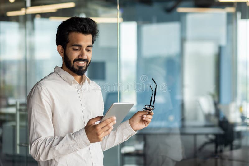 Indian Businessman with Beard Working on Tablet in Modern Office Space ...