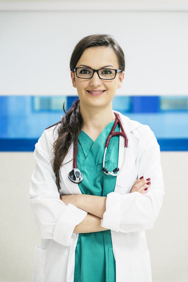 Smiling Beautiful Doctor at Hospital. Standing Stock Photo - Image of ...