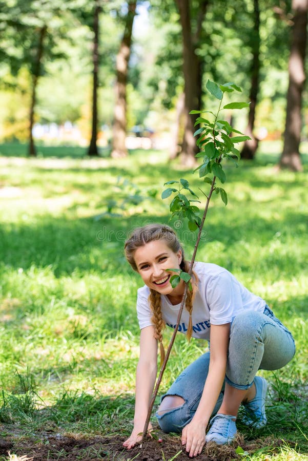 Smiling Beautiful Volunteer Planting New Tree Stock Image - Image of ...