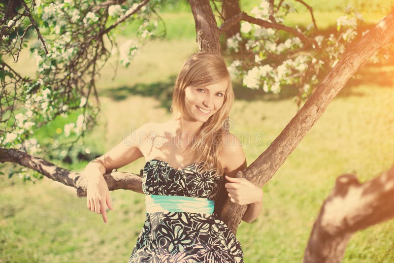 Smiling Beautiful Woman and Flowering Tree Stock Image - Image of ...