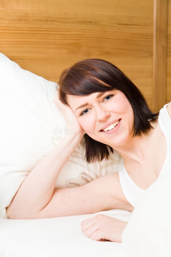 Smiling in bed stock photo. Image of attractive, sleepy - 31245544