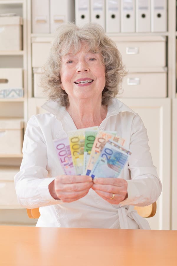 Smiling Best Ager with Money Stock Photo - Image of carefree, showing ...
