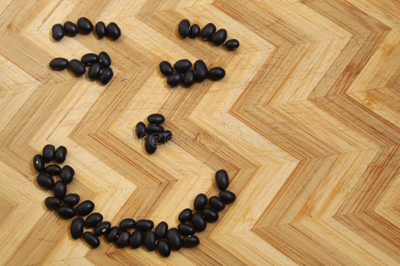 Smiling Black Bean Face on Bamboo Cutting Board, Zig-zag Pattern ...
