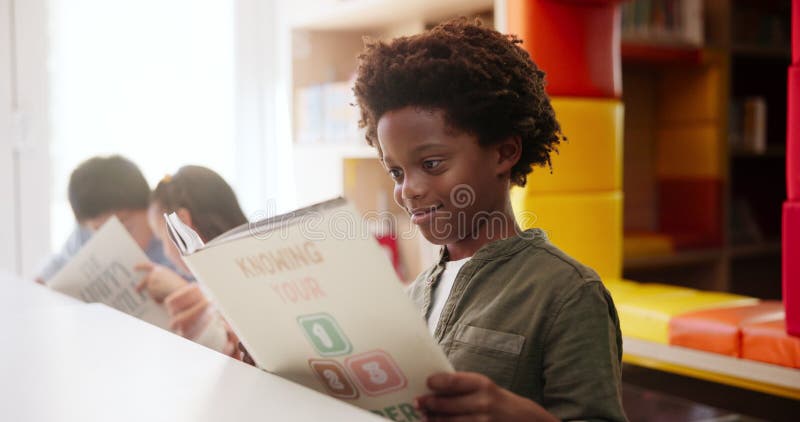 Smiling, Black Boy and Book in Classroom for Educational Development ...