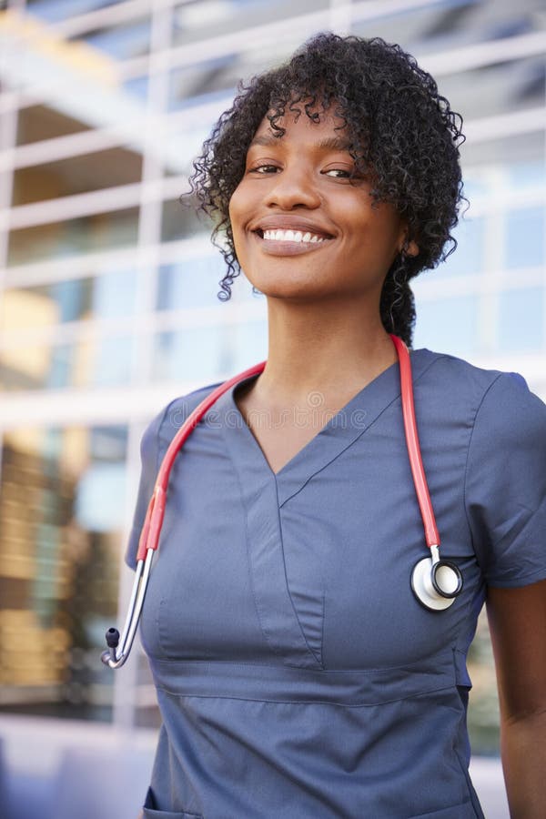 Smiling Black Female Healthcare Worker Outdoors, Vertical Stock Photo ...