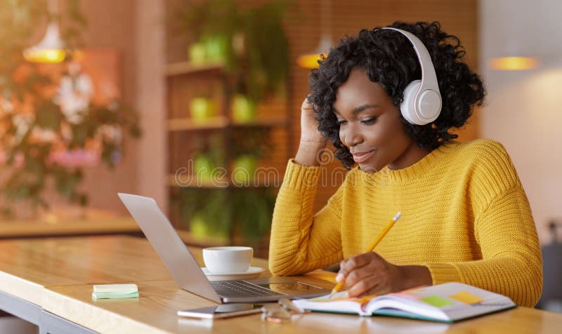 Smiling Black Girl with Headset Studying Online, Using Laptop Stock ...