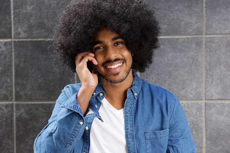 Smiling Black Man Using Cellphone Stock Image - Image of african, black ...