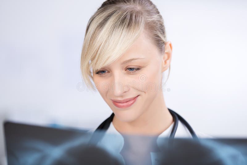 Blond Doctor Wearing Gloves Stock Image - Image of calm, doctor: 12112315