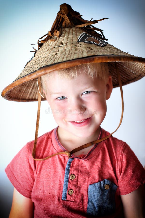 Smiling Blond Little Boy Wearing Asian Wicker Hat Stock Photo - Image ...