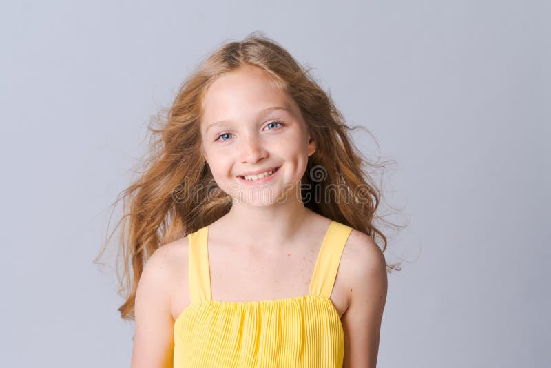 Smiling Blonde Girl In Yellow Summer Suit Posing Isolated On Light Gray Stock Image Image Of
