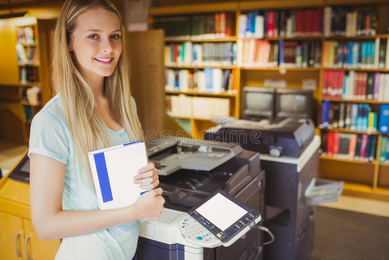 Smiling Blonde Student Making a Copy Stock Image - Image of library ...