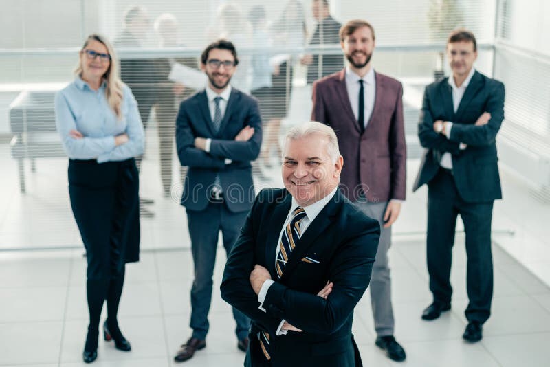 Smiling Boss and a Group of Different Employees Standing in the Office ...