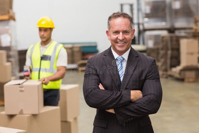 Smiling Boss Standing with Arms Crossed Stock Photo - Image of ...