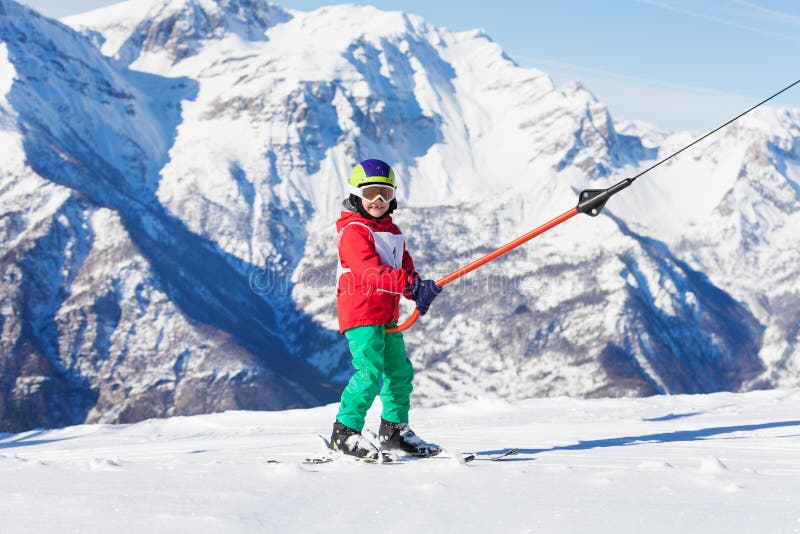 Smiling Boy on Button Ski Lift at Sunny Snowy Day Stock Image - Image ...
