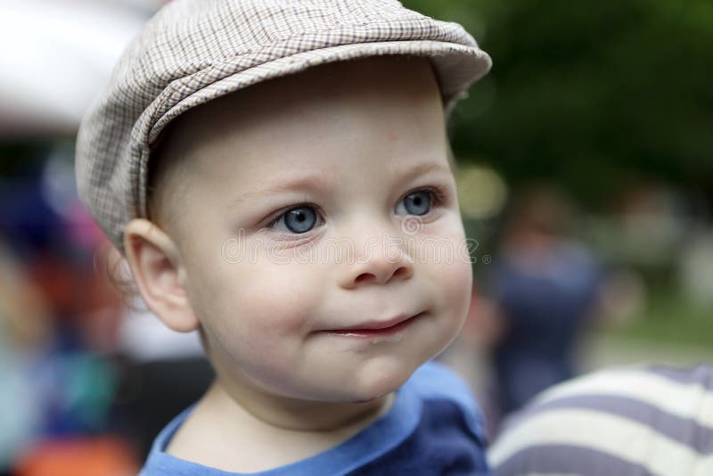 Smiling boy in cap stock photo. Image of happy, park - 74342464